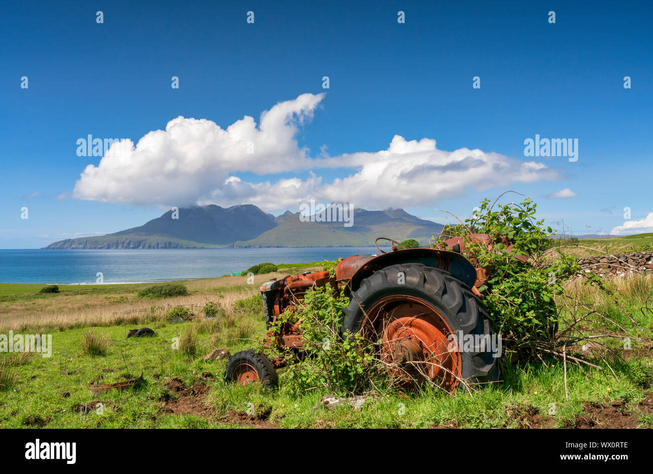 An abandoned tractor on a Cleadale Croft, with distant view of The Isle ...