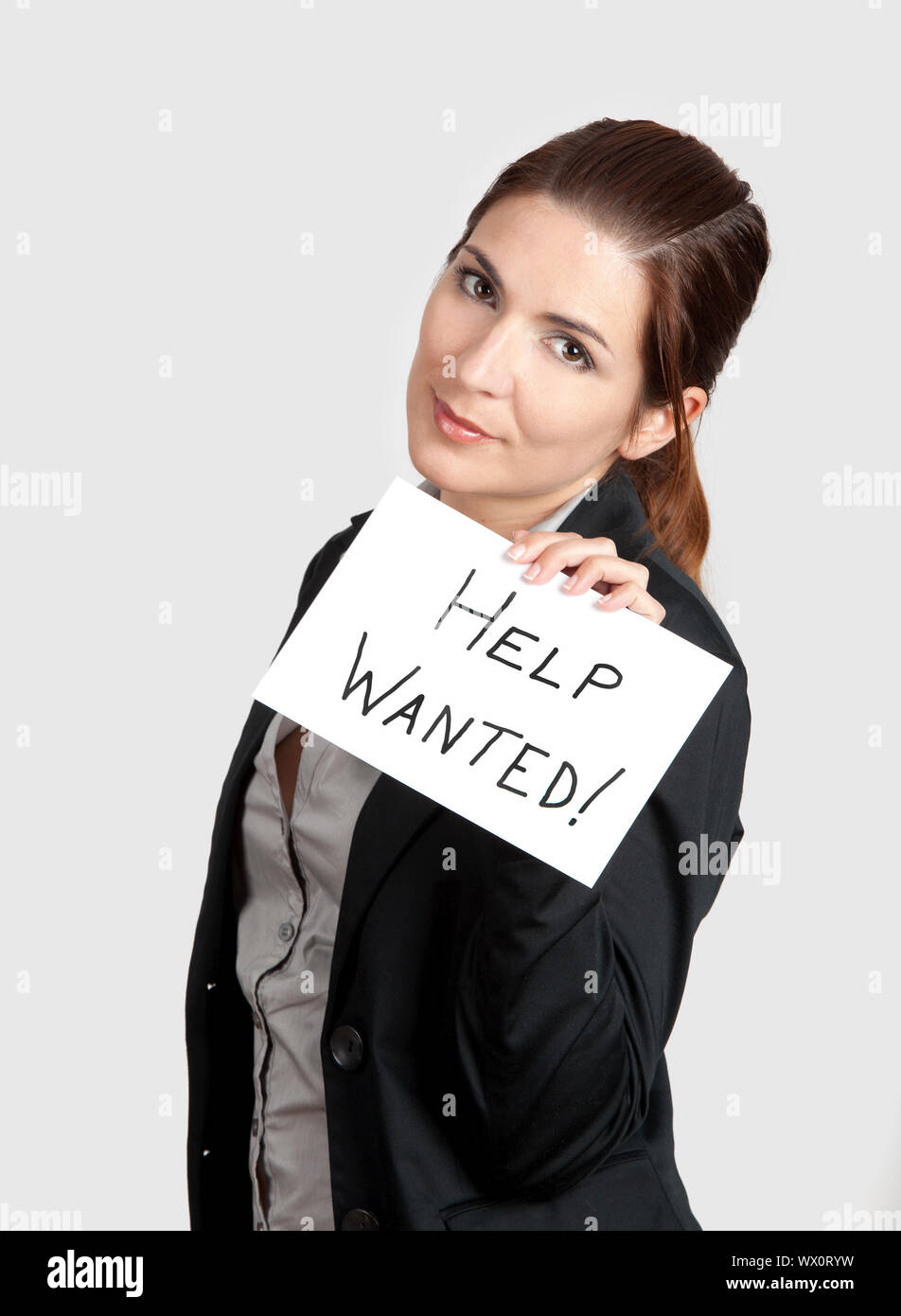 Business woman asking for help holding a cardboard with the text ...
