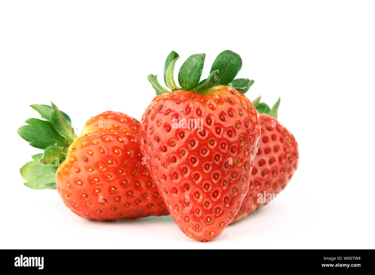strawberry pile on white background Stock Photo - Alamy