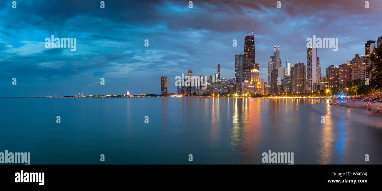 View of Chicago skyline at dusk from North Shore, Chicago, Illinois ...
