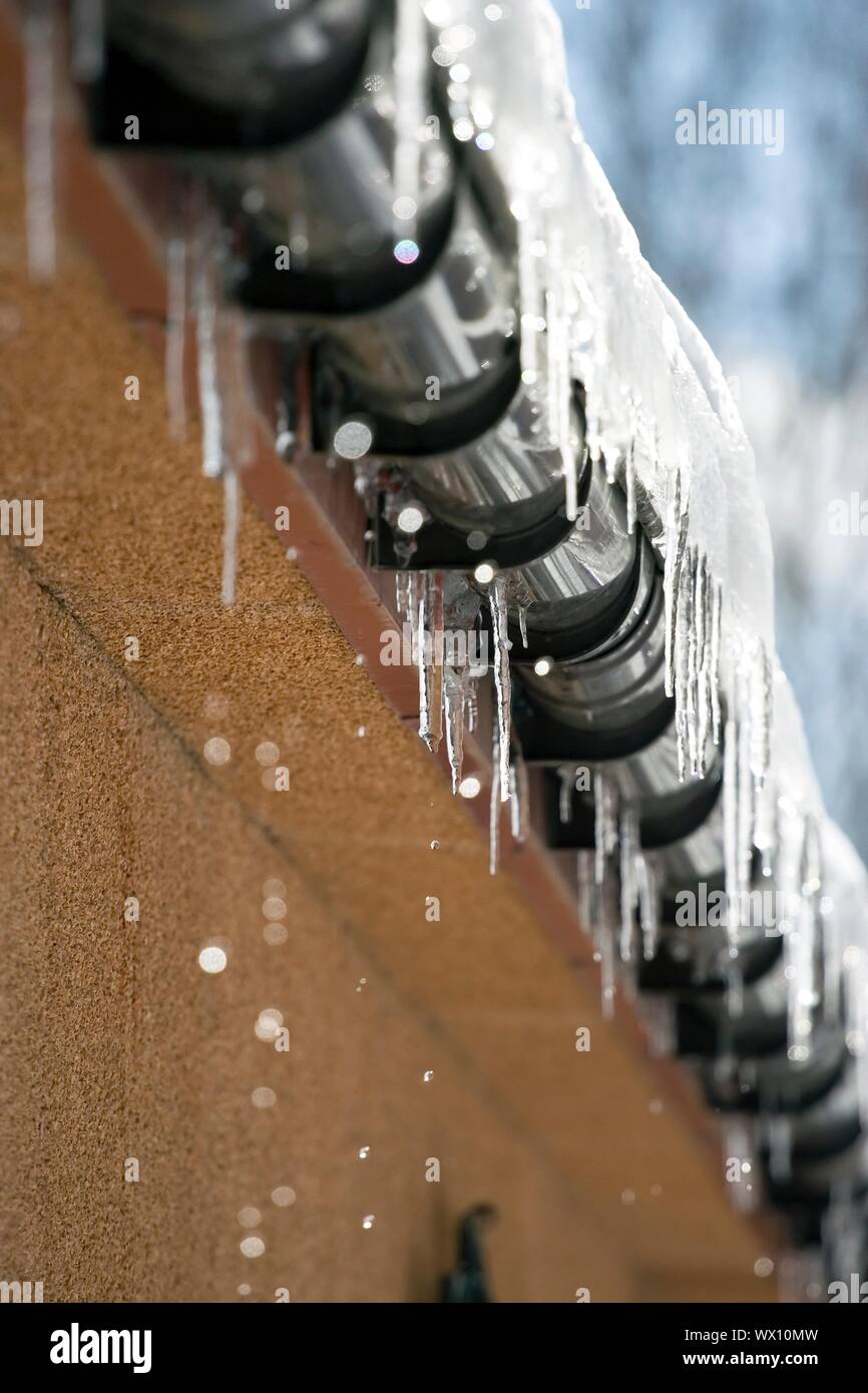 Water drops from the roof Stock Photo - Alamy