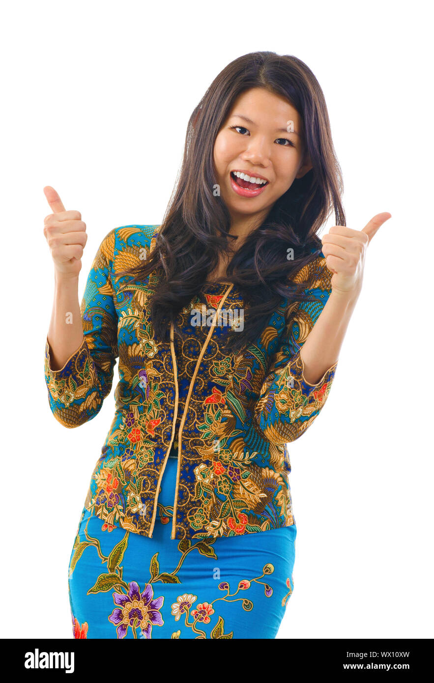 Thumbs up Asian woman in kebaya, over white background Stock Photo - Alamy