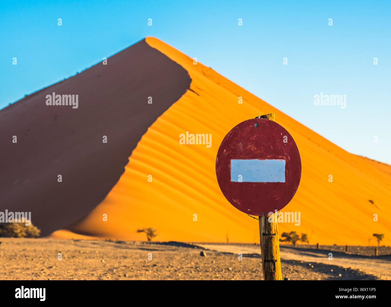 Stop sign in front of sand dune in Sossusvlei, Namib-Naukluft National ...
