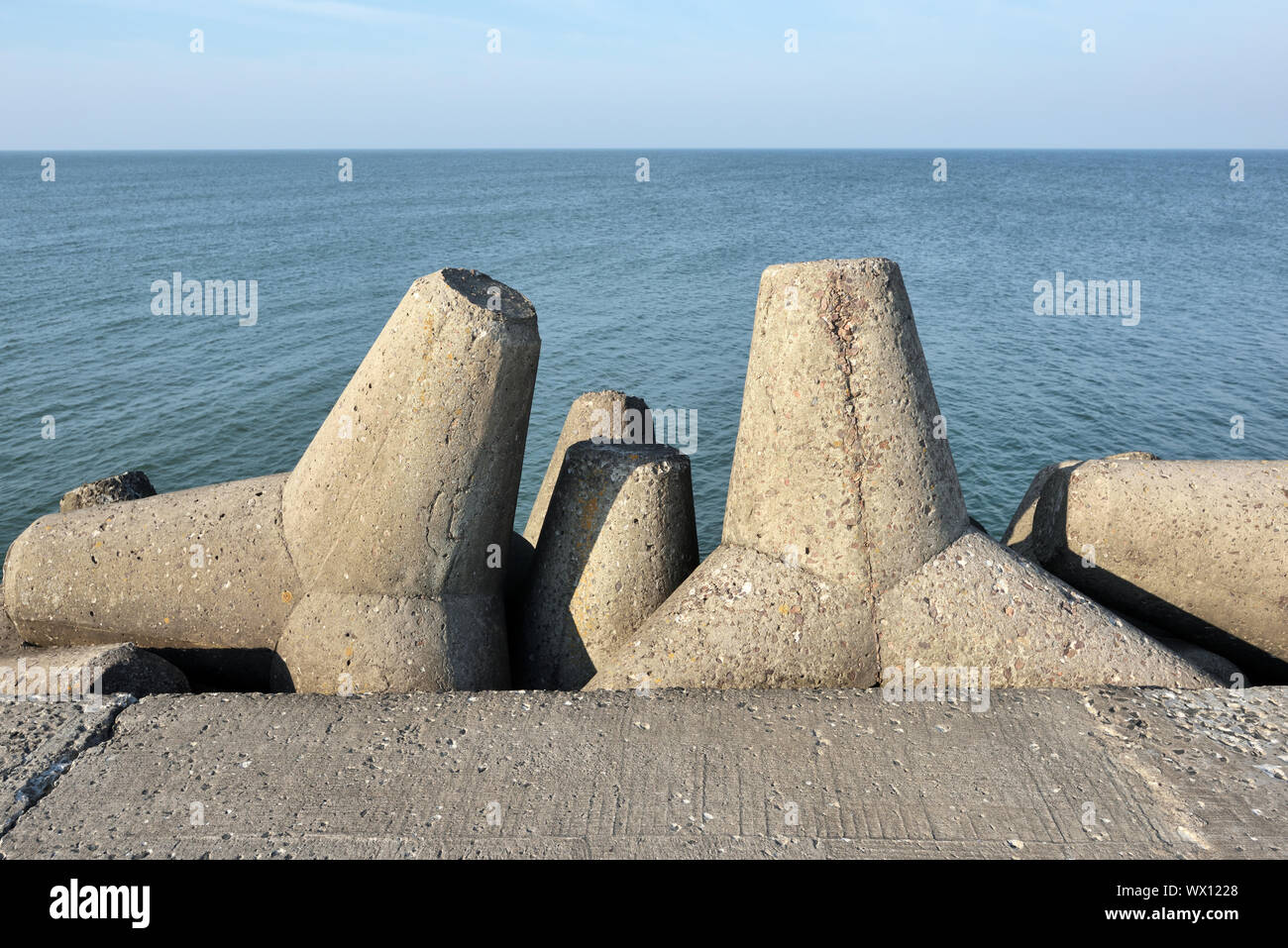 Concrete breakwaters. Seascape with concrete tetrapodes to protect ...