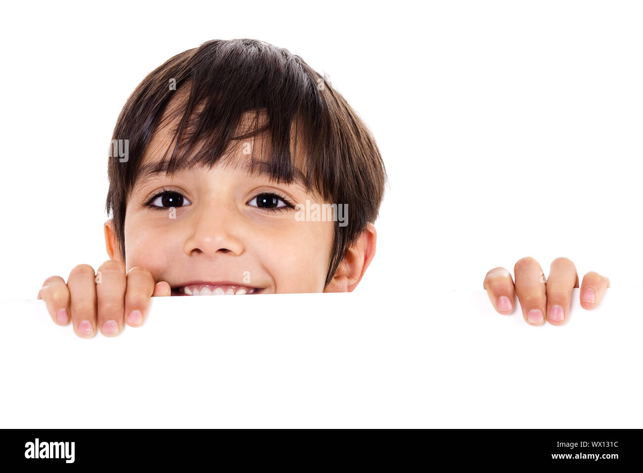 Young boy lifting his head out of the blank board on isolated ...