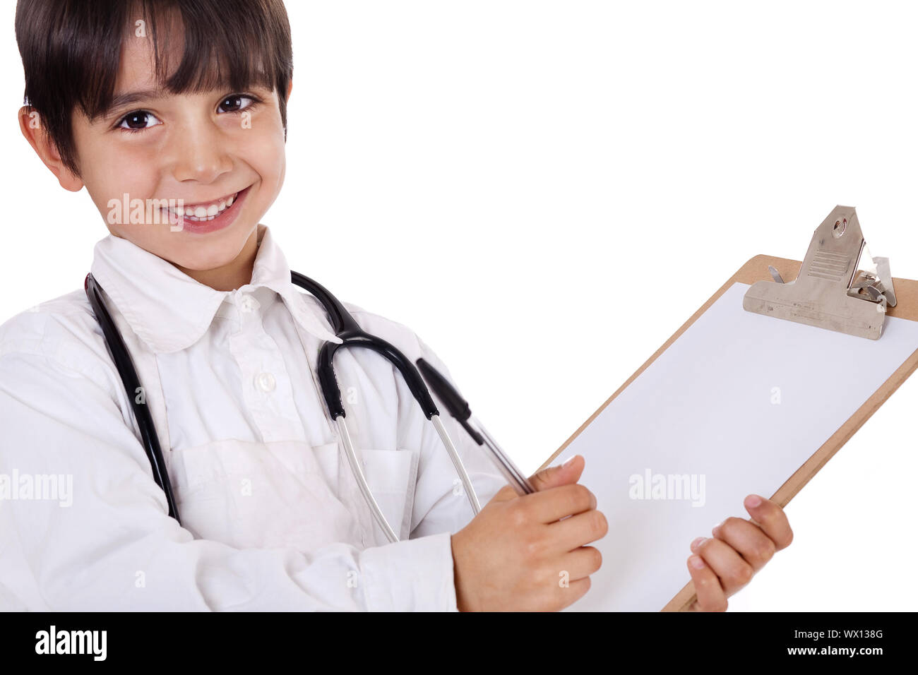 Little boy doctor writes on his clipboard for diagnosis on white ...