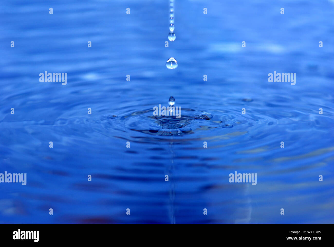 The round transparent drop of water falls downward Stock Photo - Alamy