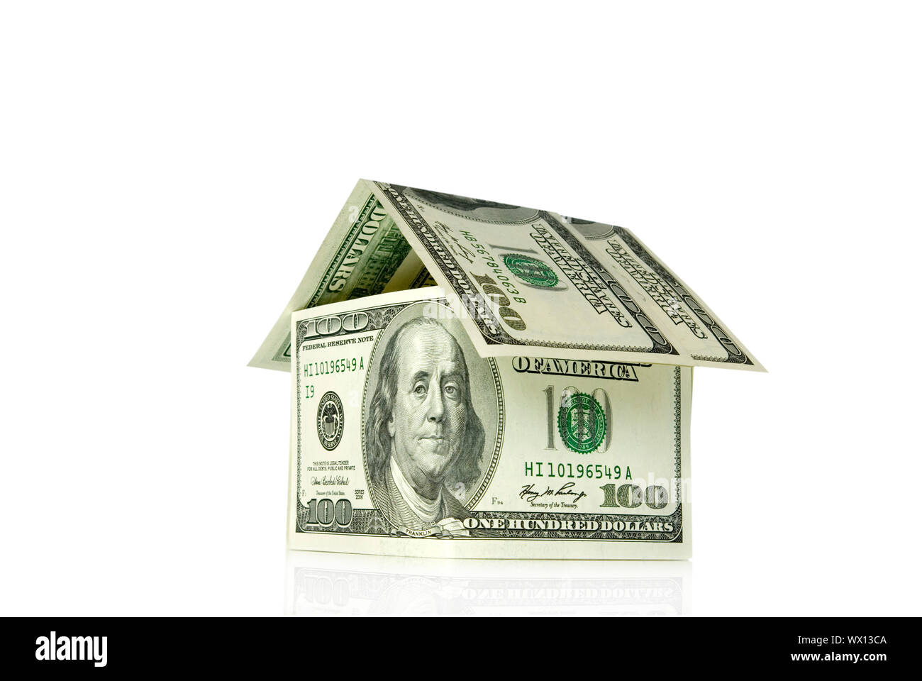 Money house on white background Stock Photo - Alamy