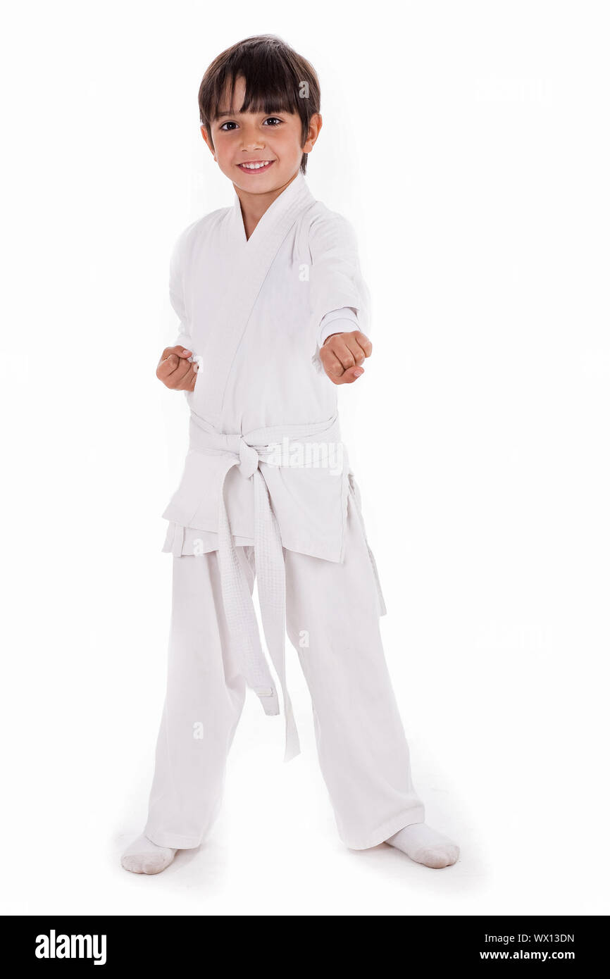Small karate boy in training isolated white background Stock Photo - Alamy