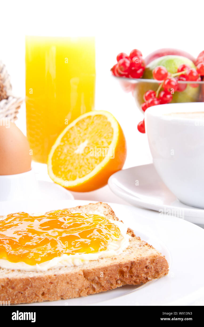 breakfast table with toast and orange marmelade isolated on white ...