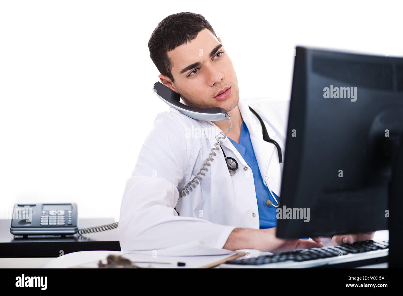 Doctor logging his notes in computer over white background Stock Photo ...
