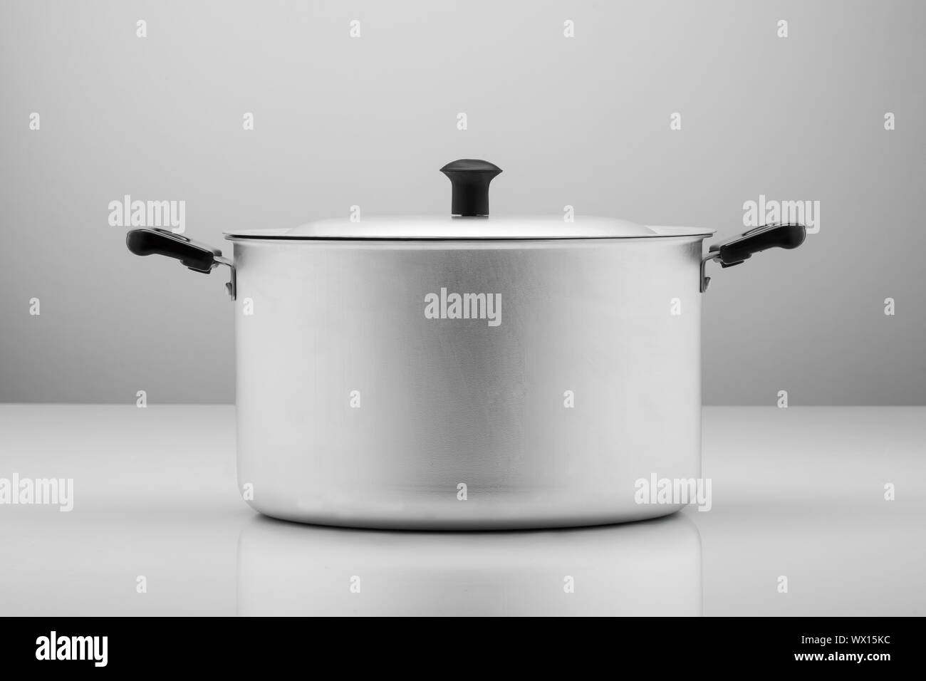 kitchen aluminum pan on light background with reflection Stock Photo ...