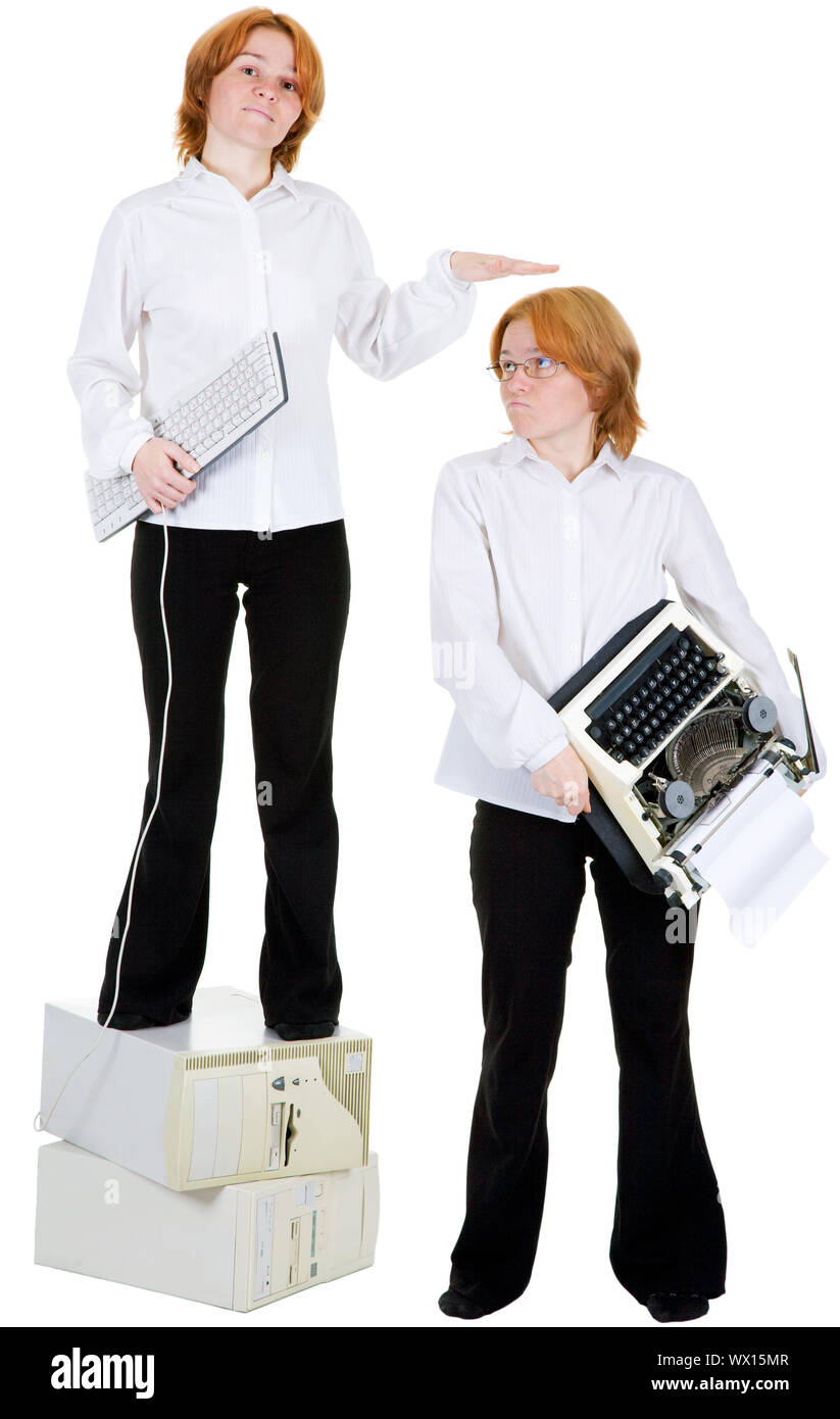 Two girls. One with the computer keyboard, and the second with a ...