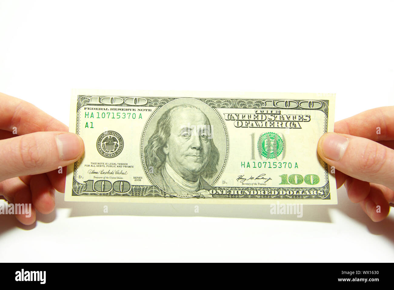 Money in hand isolated on white background Stock Photo - Alamy