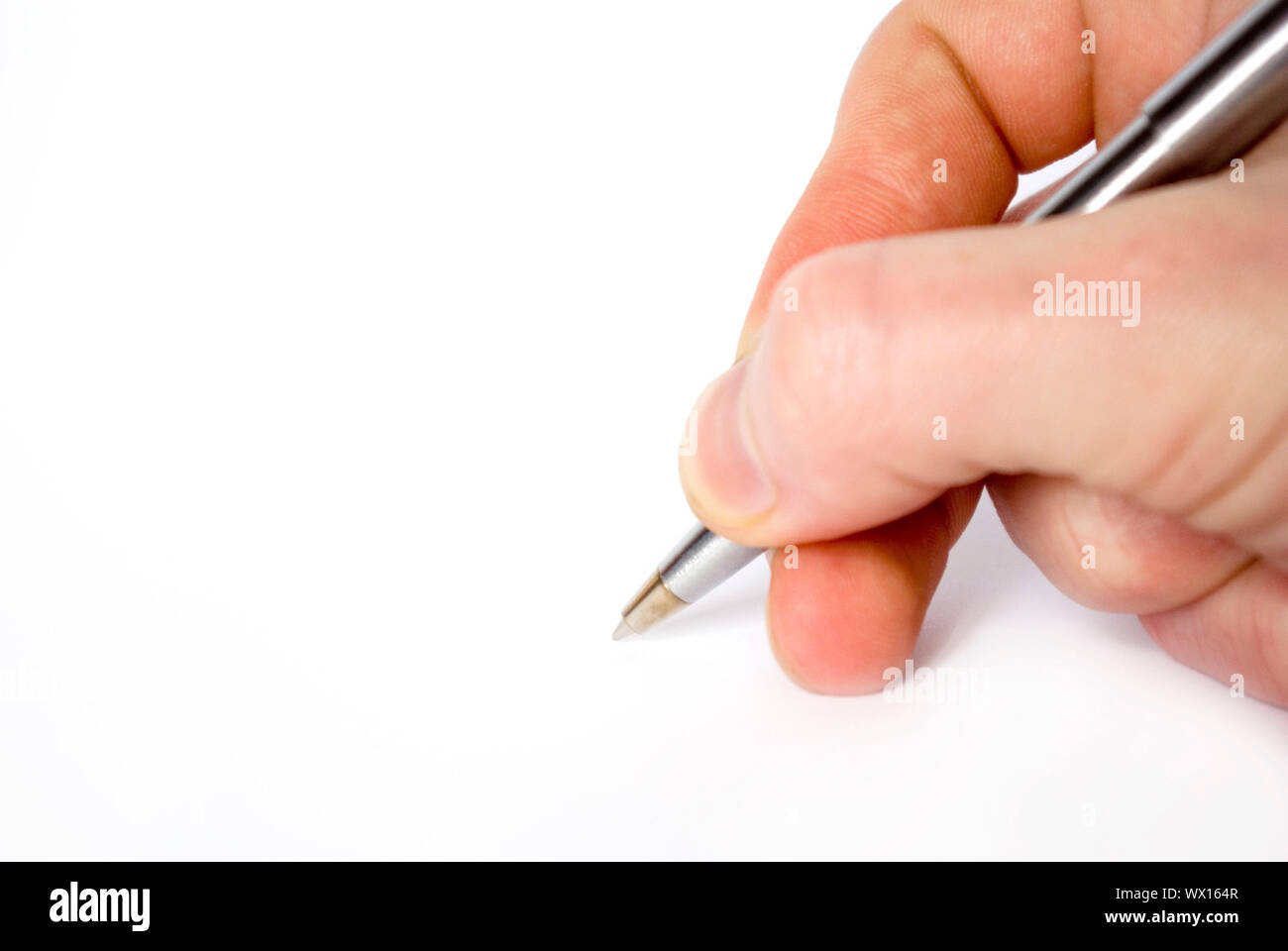 Hand holding pen isolated on white background Stock Photo - Alamy