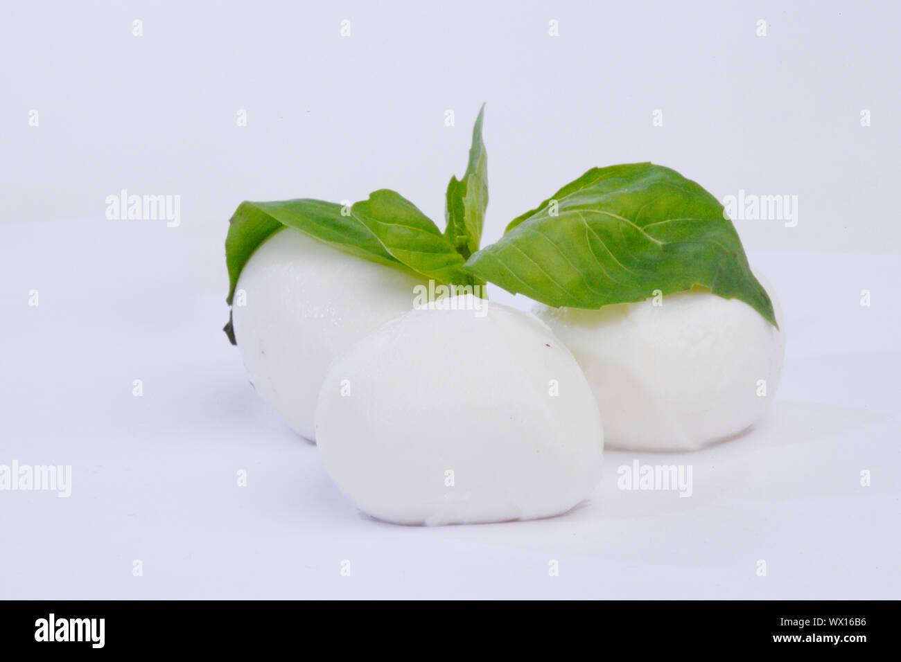 fresh italian mozzarella on white background Stock Photo - Alamy