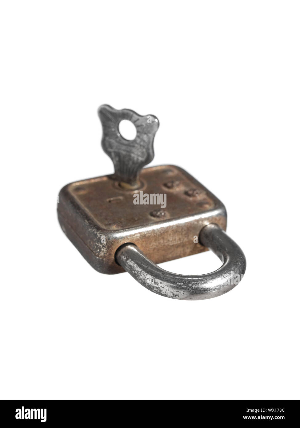 A closed lock with a key isolated on white background Stock Photo - Alamy