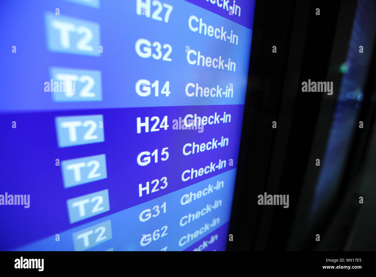 check in desk in airport Stock Photo - Alamy