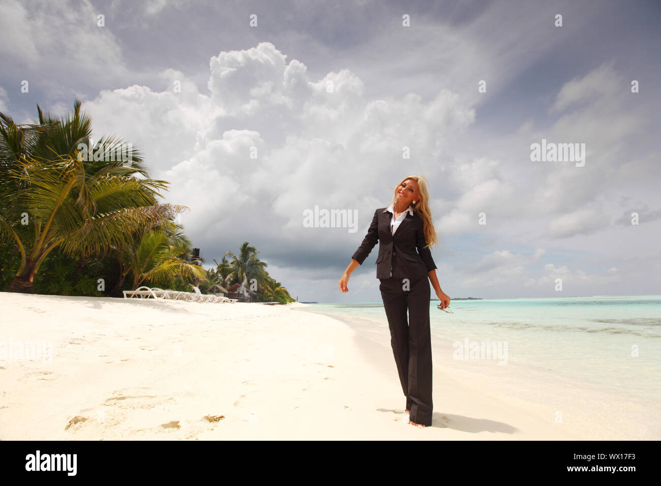 happy business woman on the desolate ocean coast Stock Photo - Alamy