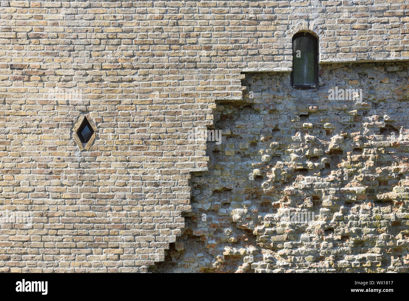 Old wall of medieval castle made of white bricks and stone Stock Photo ...