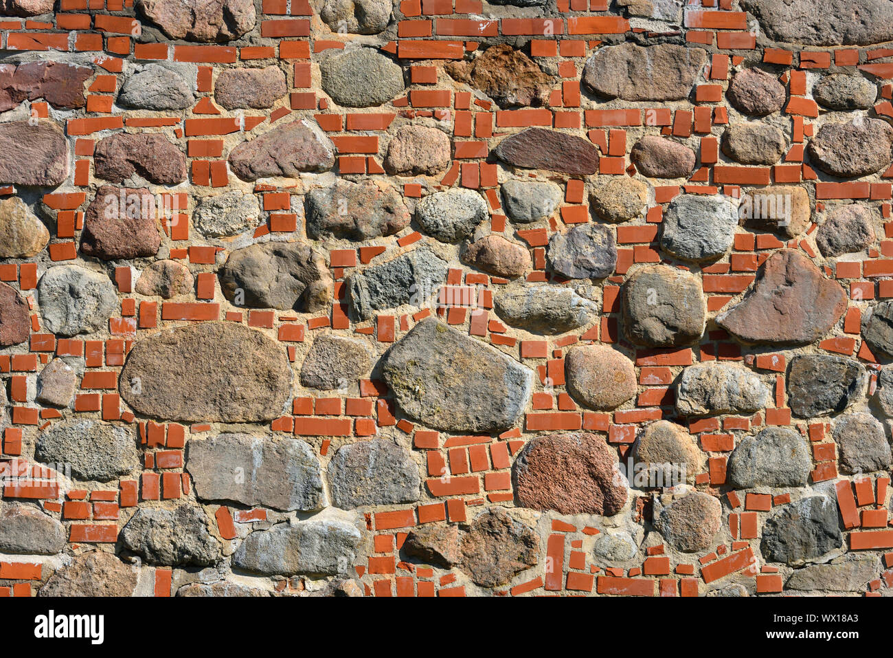 Closeup view of old wall of medieval castle made of red bricks and ...