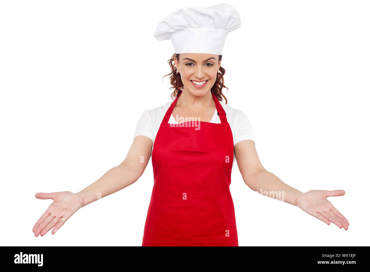 Smiling woman chef welcoming you to her workplace. Isolated over white ...