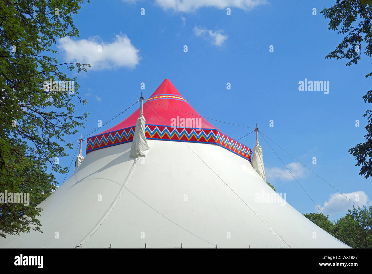 Blue and yellow circus tent hi-res stock photography and images - Alamy