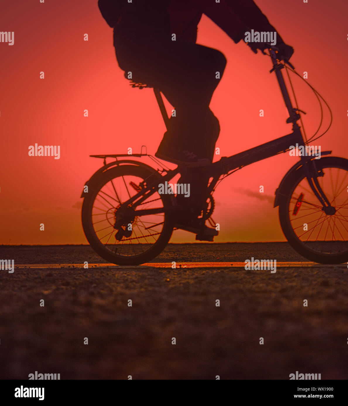Bikes on beach, sunset sky background Stock Photo - Alamy