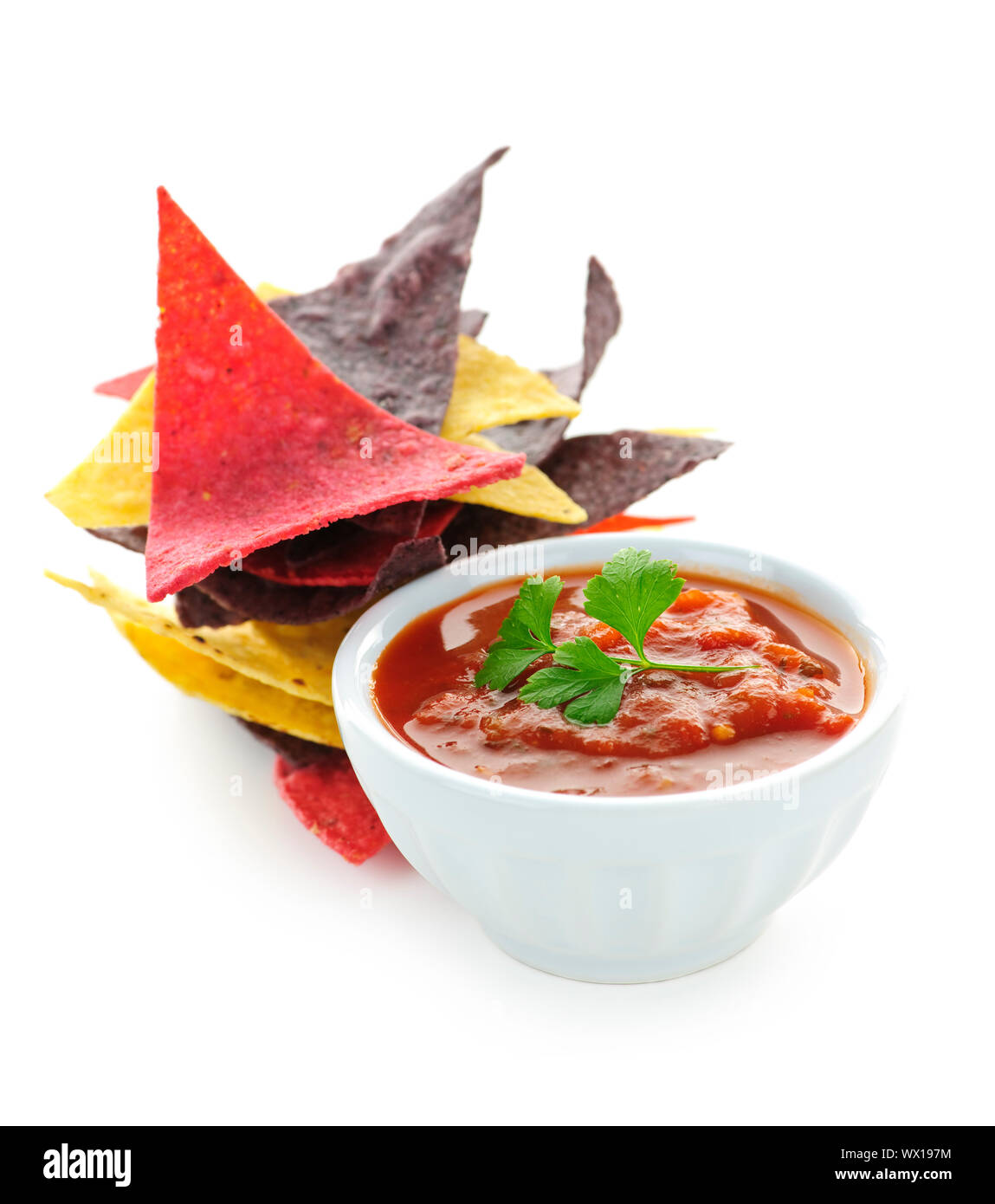 Bowl of salsa with colorful tortilla chips isolated on white background ...