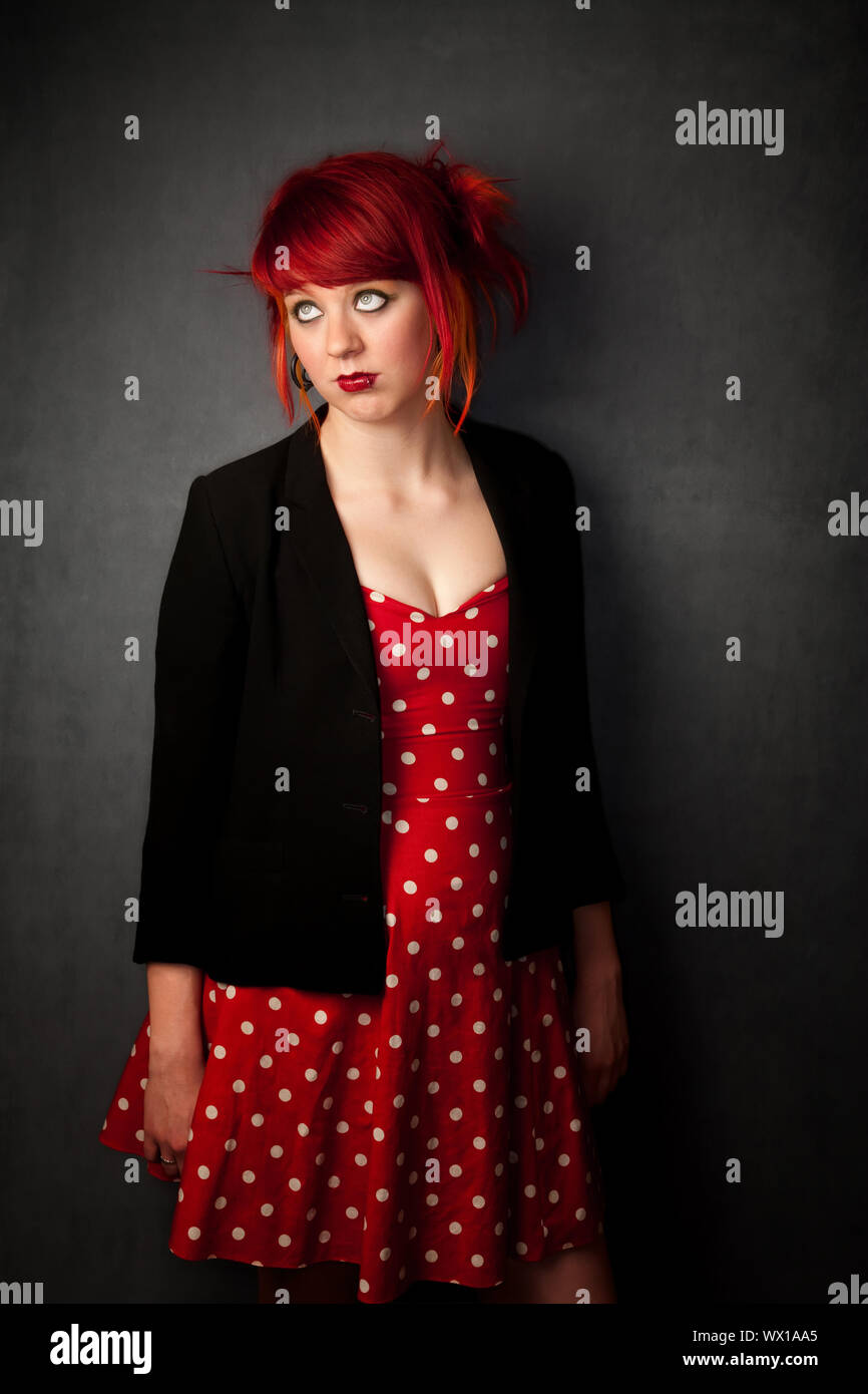 Pretty punky girl with brightly dyed red hair Stock Photo - Alamy