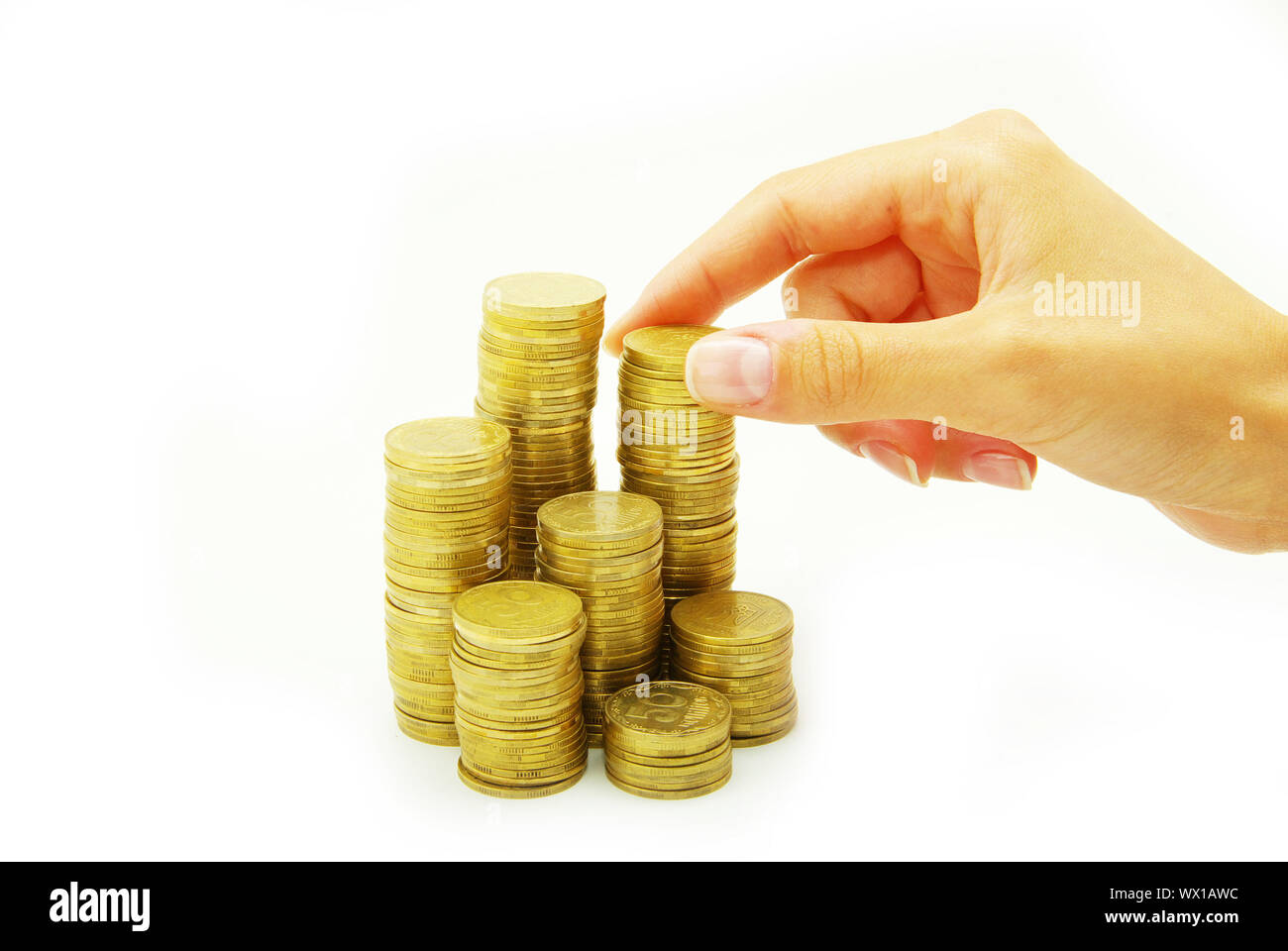 Hand put coin to money staircase isolated on white background Stock ...