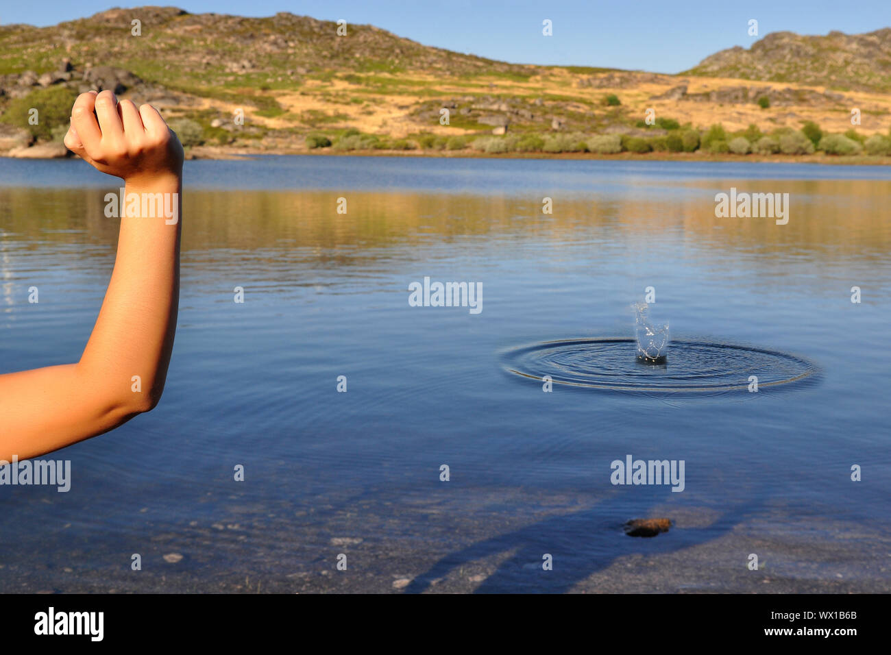 Throwing pebbles into sea hi-res stock photography and images - Alamy