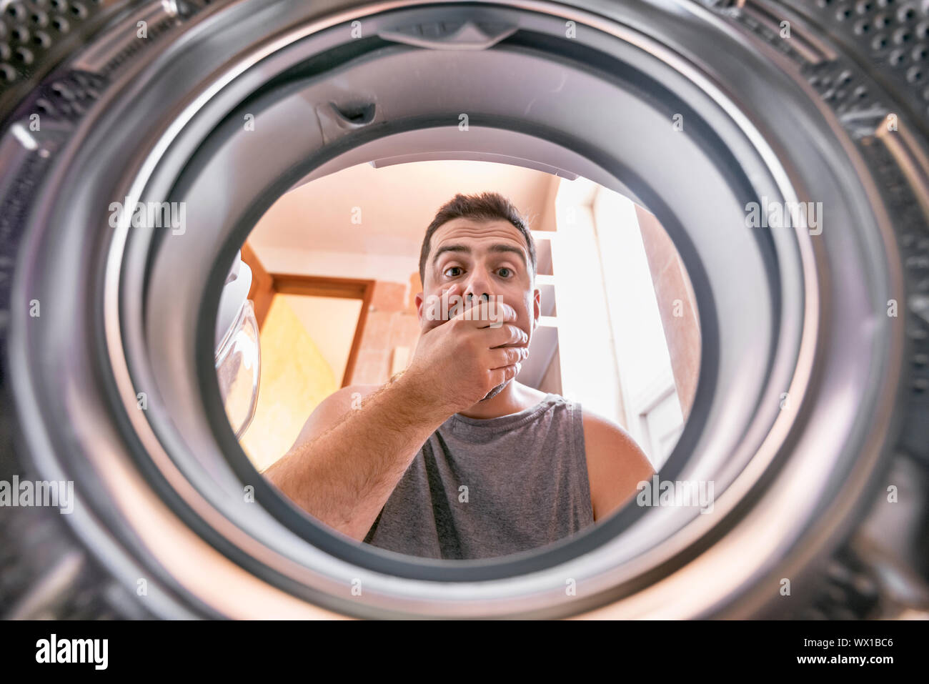 Wash washing machine clothes view from inside drum tumble person hi-res ...