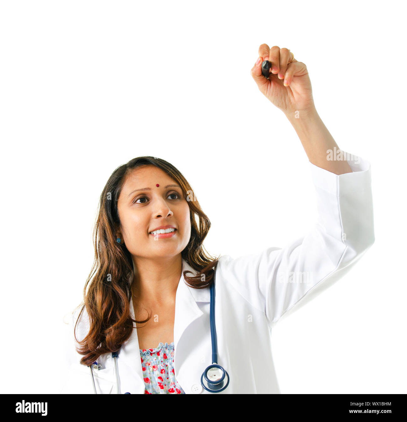 Asian Indian female doctor drawing over white background. Medical ...