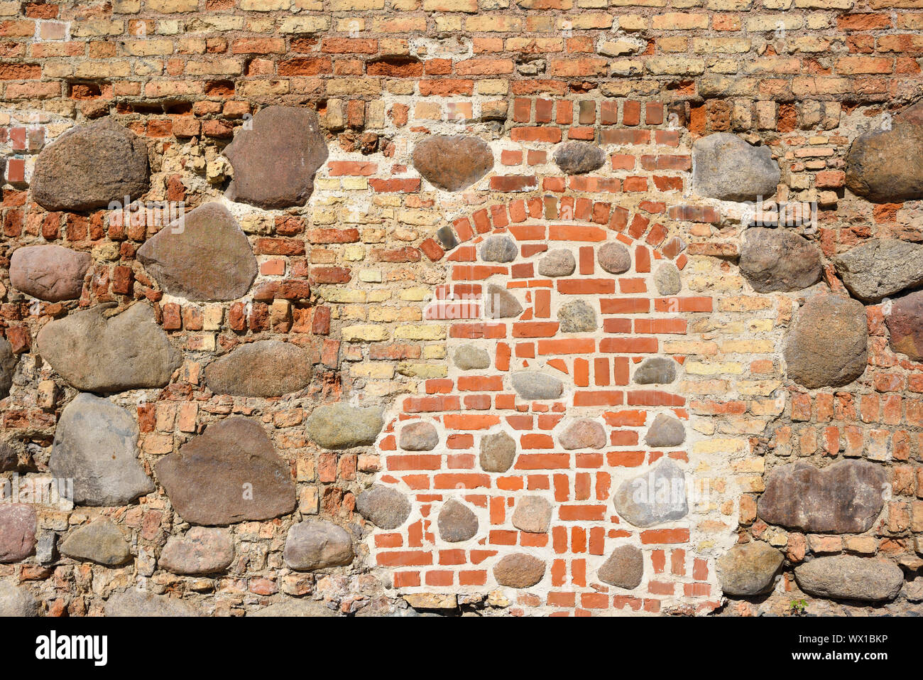 Closeup view of old wall of medieval castle made of red bricks and ...