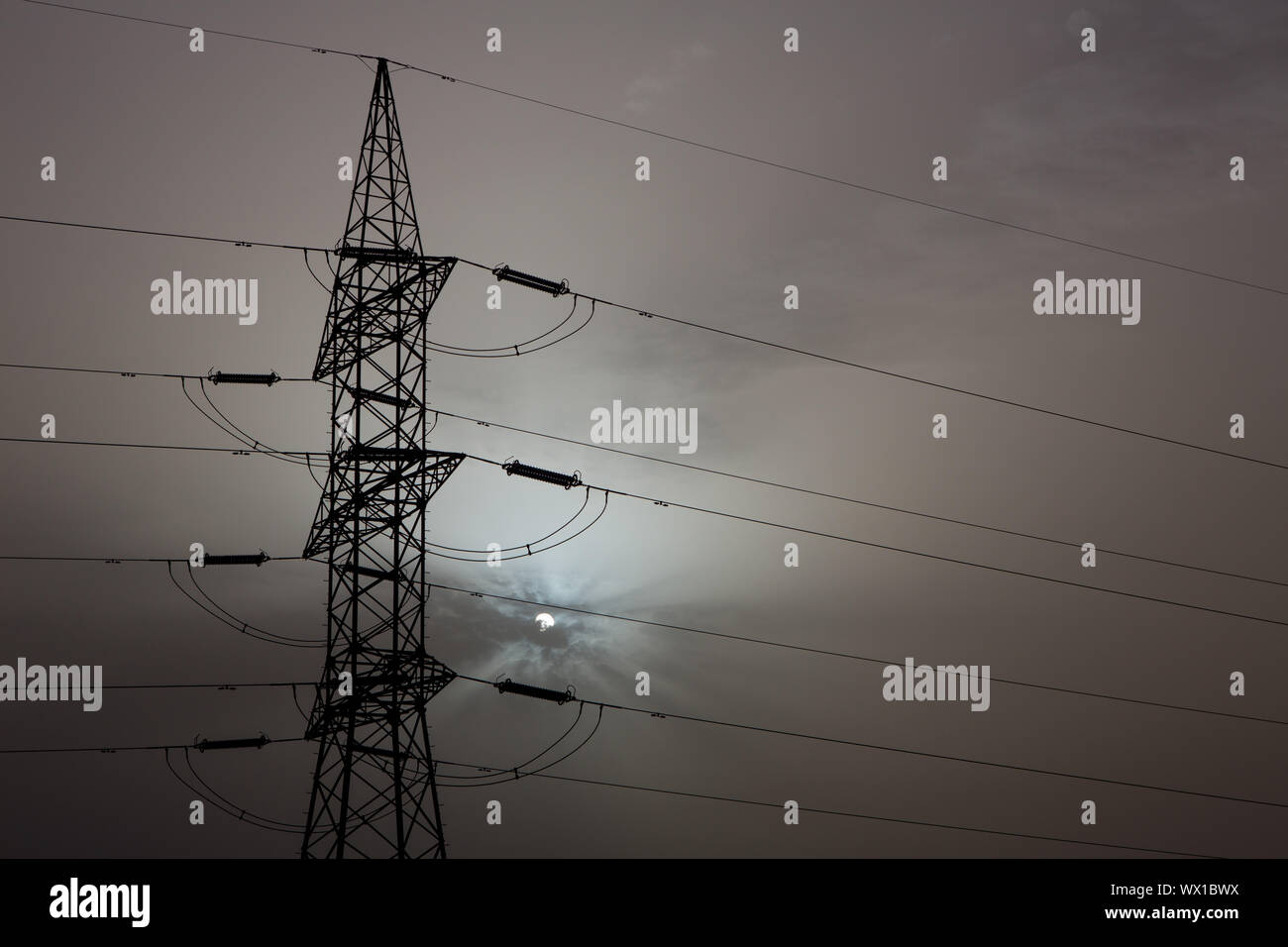 Dramatic clouds sky and electric tower backlight silhouette Stock Photo ...