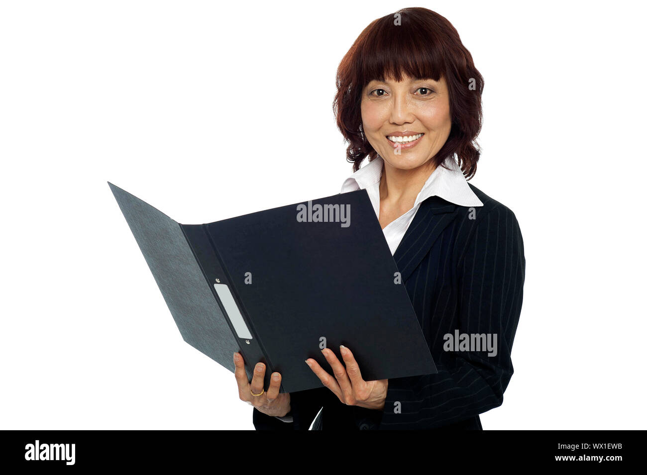 Young female asian boss going through the file isolated against white ...
