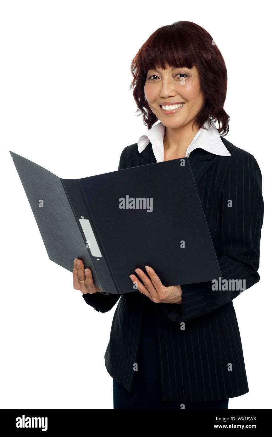 Secretary holding opened binder, smiling. Isolated against white ...