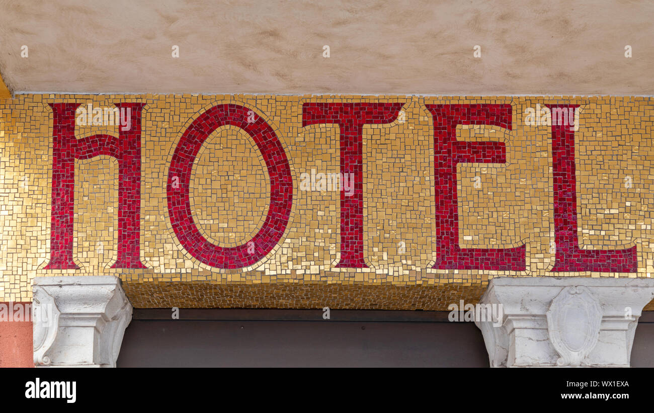 Old style hotel letters sign at gold tiles mosaic hi-res stock ...