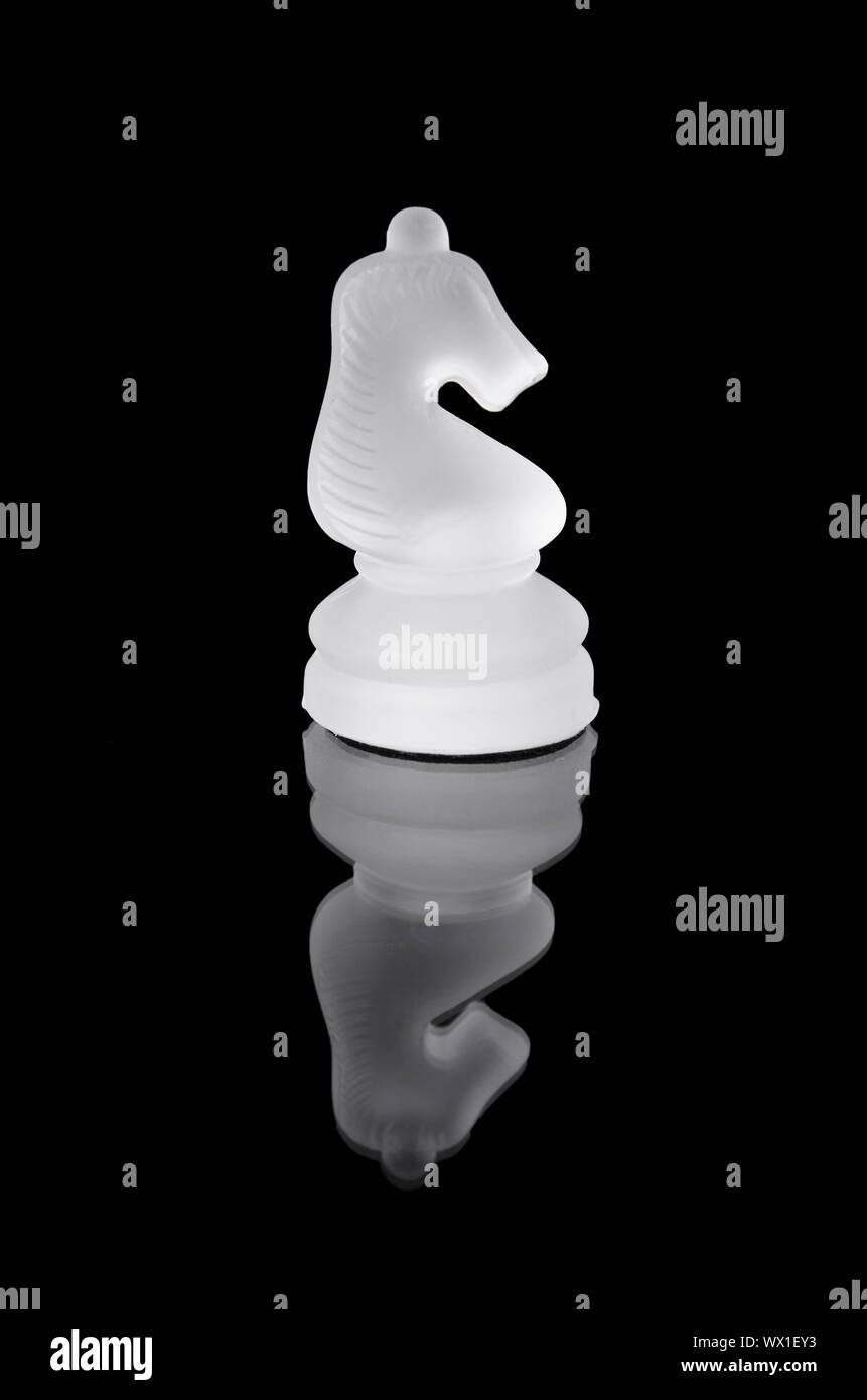 Glass chess knight on black isolated background Stock Photo - Alamy