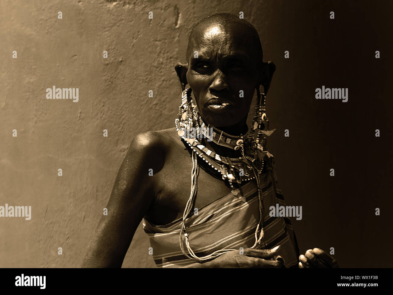Portrait of an African lady that dressed traditionally, sepia toned ...