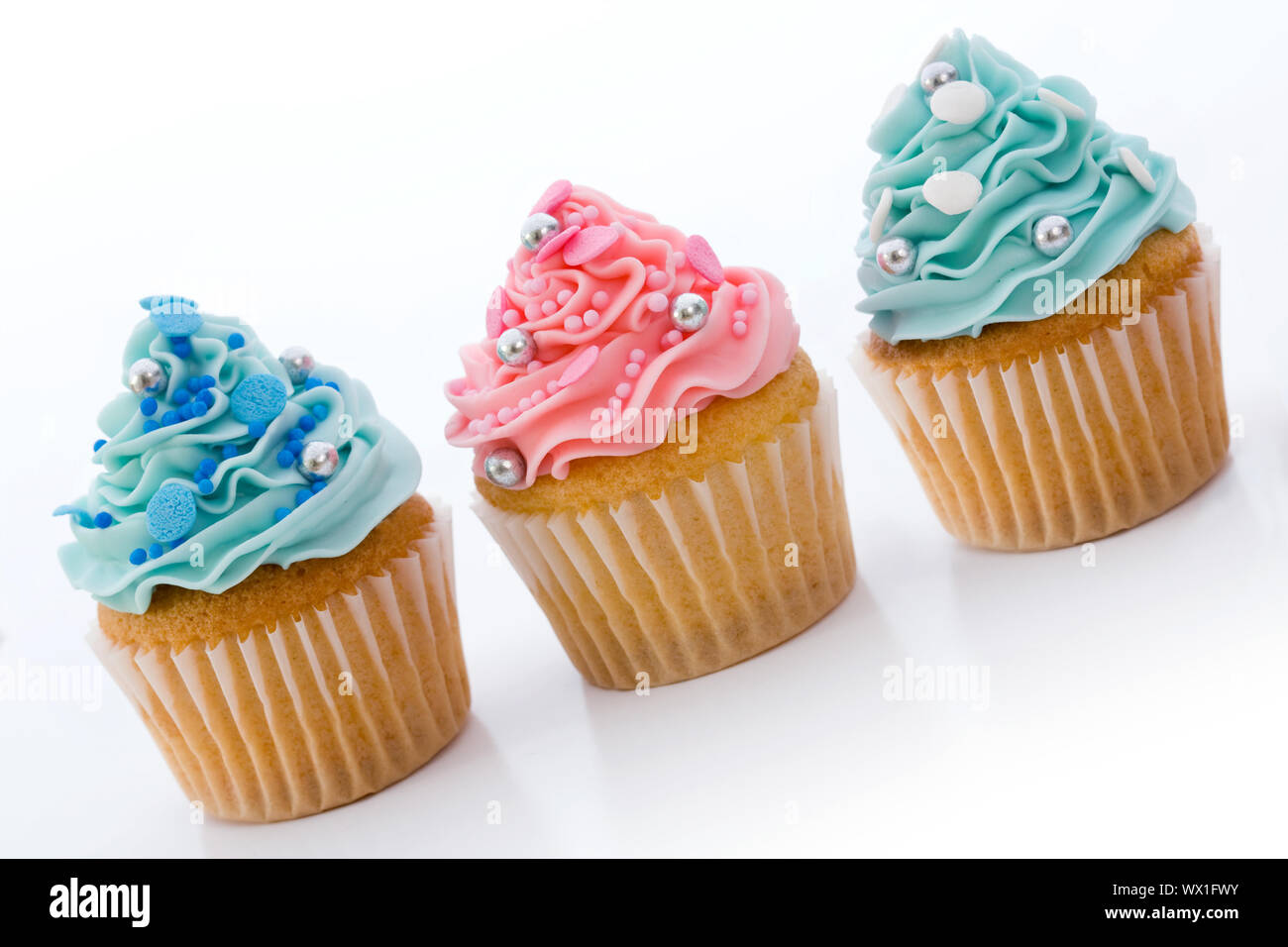 Three cupcakes in a row Stock Photo - Alamy