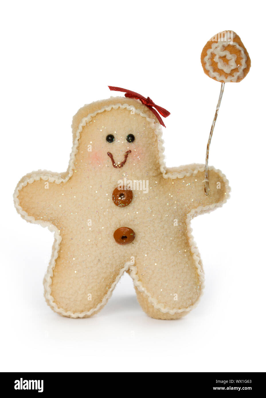 Smiling gingerbread man toy decorated with buttons and bow Stock Photo ...