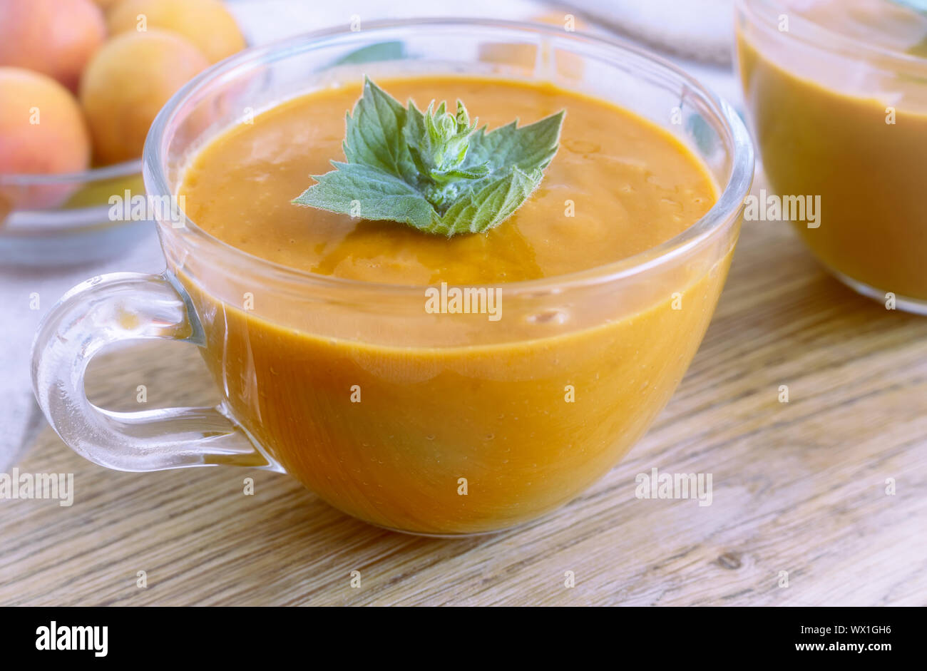 Apricot smoothie in a glass Cup Stock Photo - Alamy