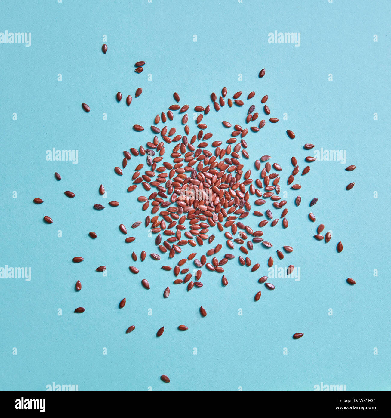 Flax seeds pattern on blue paper background. Flaxseed or linseed Stock ...
