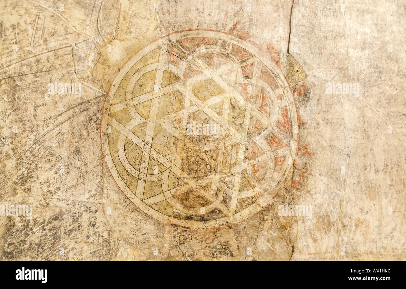 Ancient Arabic symbol painted on the wall Stock Photo - Alamy
