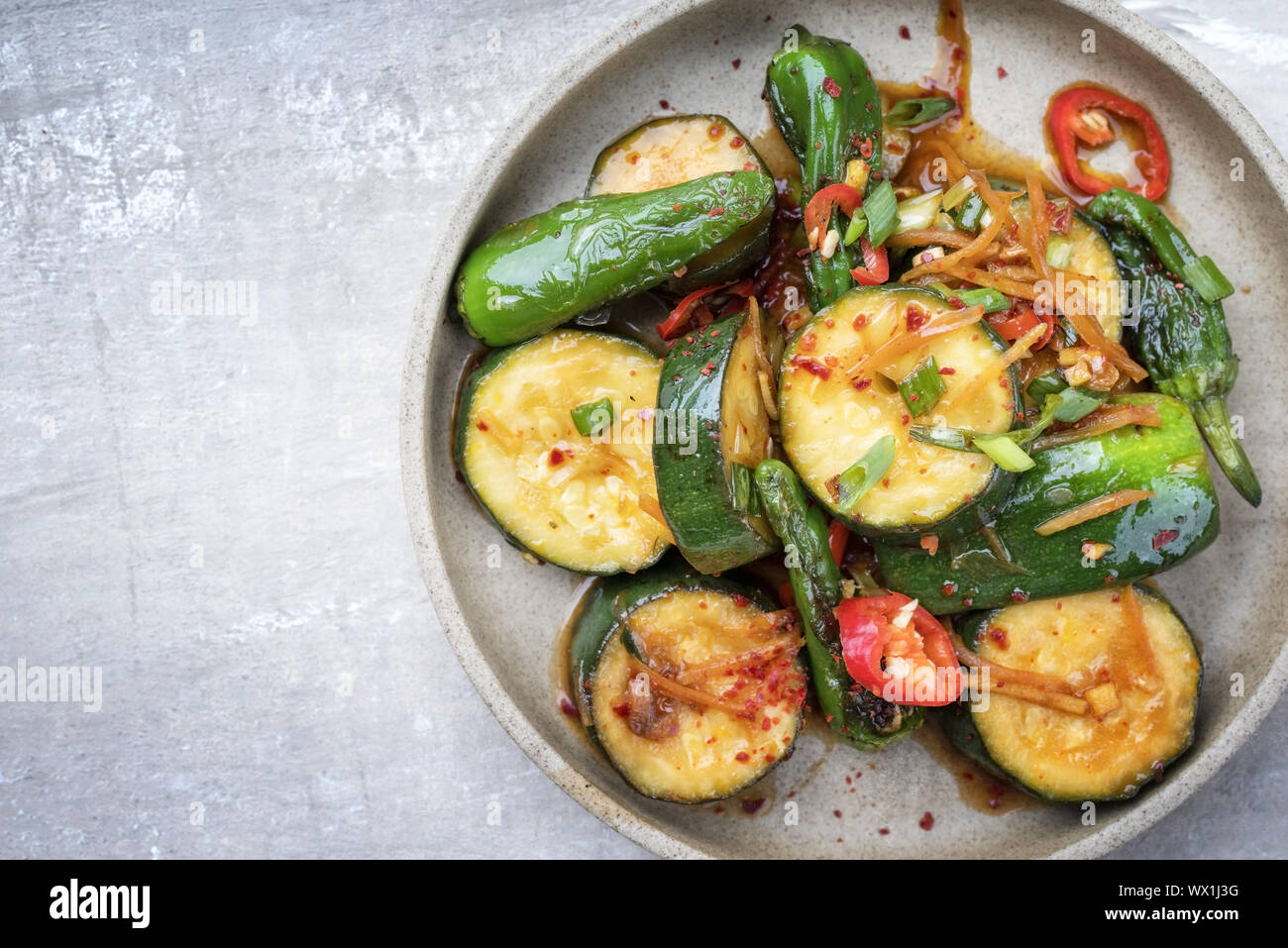 Traditional Korean banchan with kimchi and vegetable as top view on a ...