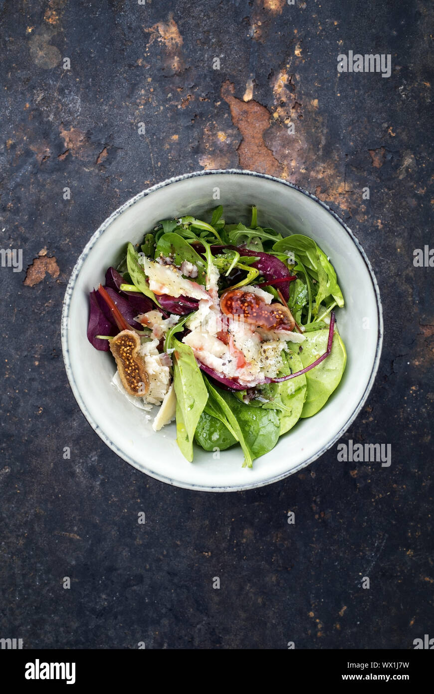 Traditional Italian lettuce with tomatoes and fig as top view on a ...