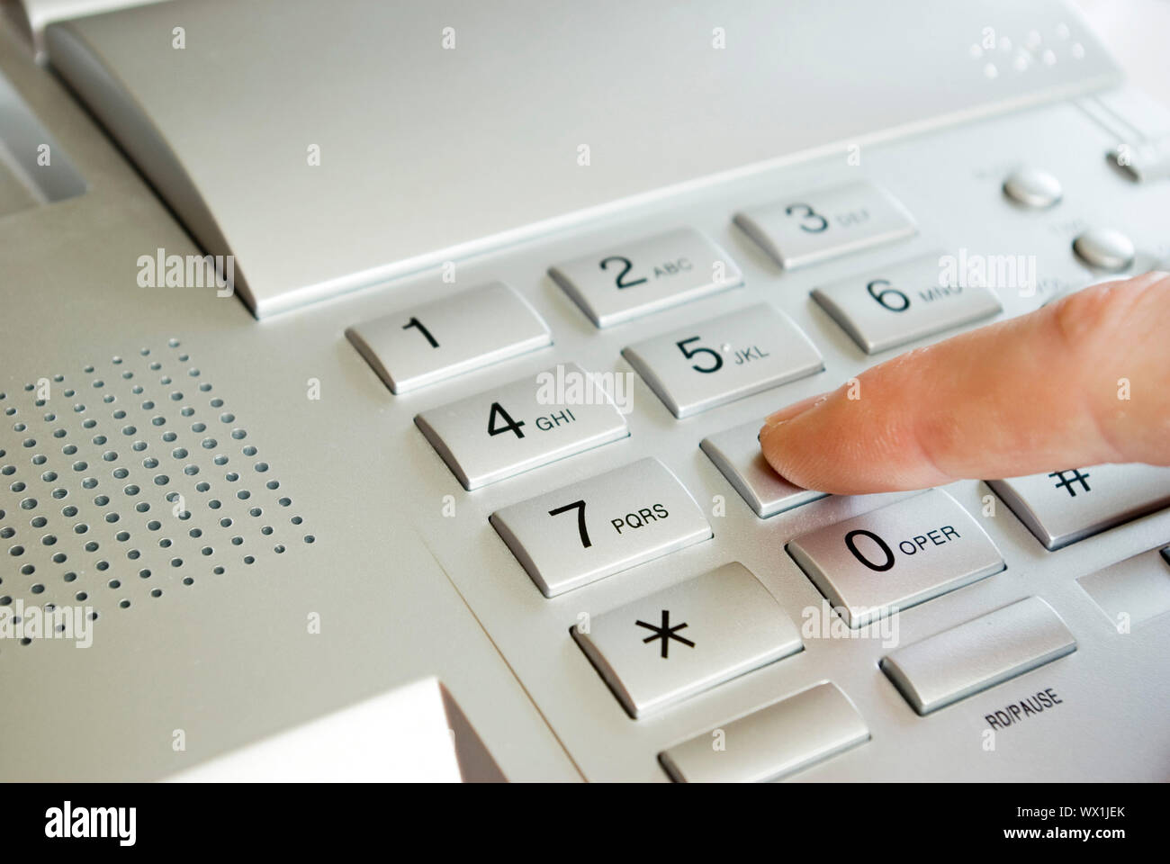 finger with grey telephone keypad Stock Photo - Alamy