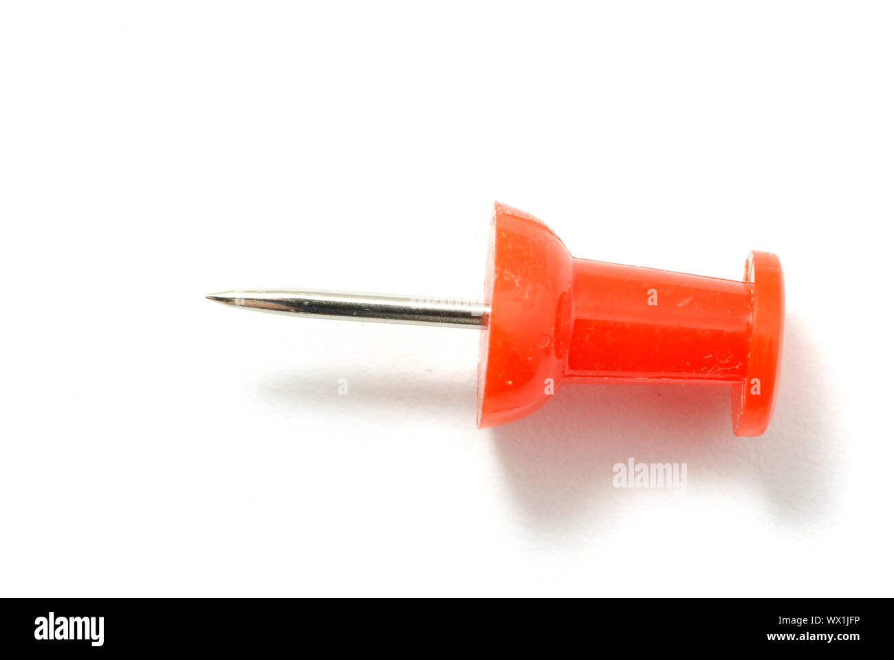red push pin isolated on white background Stock Photo - Alamy